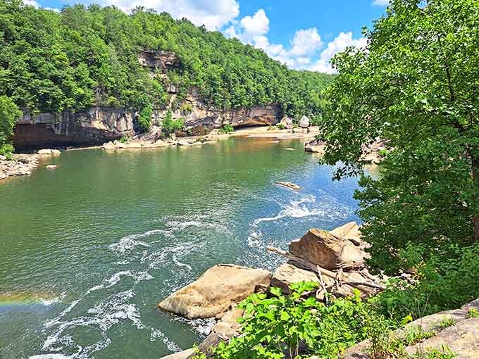 Sandstone cliffs embrace rushing waters where nature carved beauty worthy of any postcard or painting.