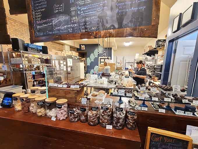 The counter display reveals a chocolatier's workshop where magic happens daily, right before your very eyes and nose.