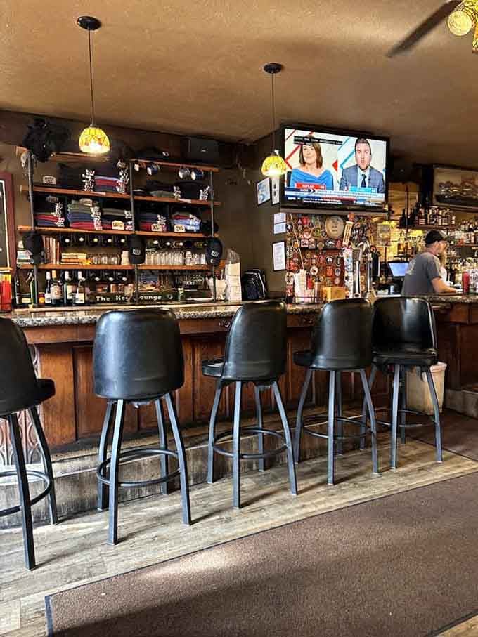 Industrial lighting fixtures against brick walls create an ambiance that feels both historic and welcoming at once.