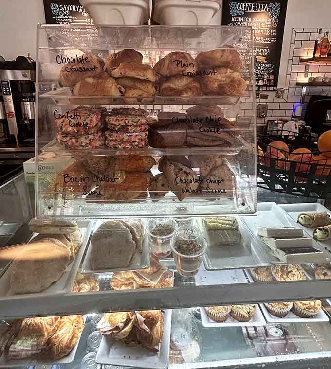Fresh pastries displayed behind glass like edible artwork, each one begging you to abandon your diet just this once.