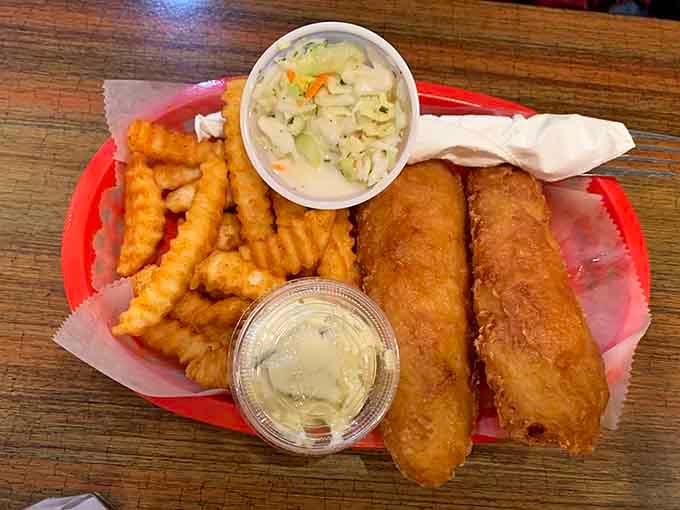 Golden fish and chips with coleslaw prove this burger joint can handle seafood with the same dedication and delicious results.