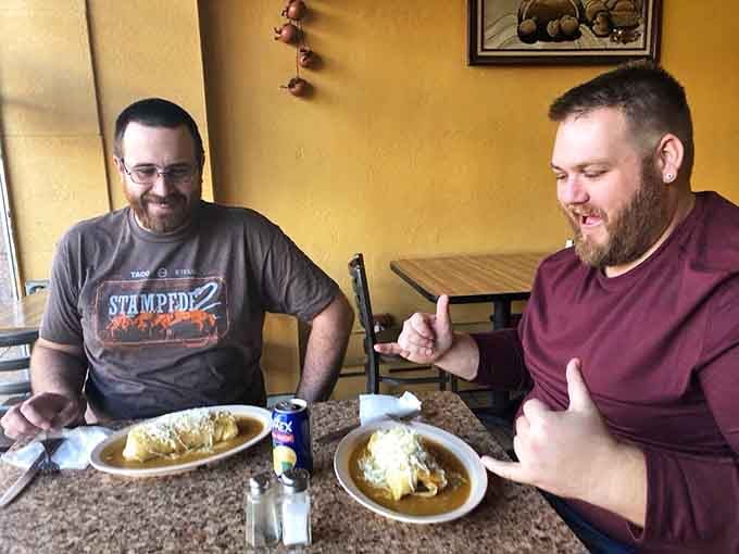 Happy diners enjoying generous portions prove that La Abeja's reputation for quality and value is well-earned.