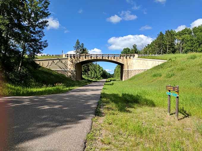 That historic stone bridge over the trail adds architectural charm to your nature walk, fancy that.