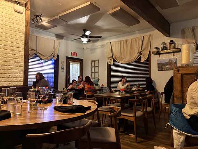 Exposed beams and thoughtful lighting create ambiance that makes every meal feel like a special occasion worth remembering fondly.
