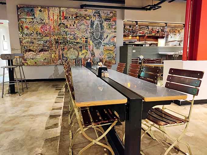 Colorful artwork and communal tables create a vibe that's equal parts art gallery and neighborhood pizza hangout.