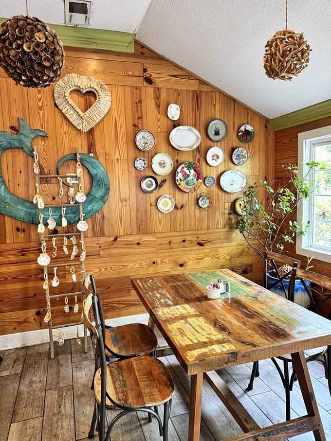 The wall decor features decorative plates and a heart that perfectly captures the restaurant's whimsical, welcoming spirit throughout.