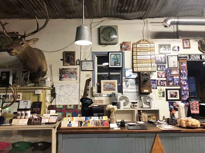 The counter area decorated with Texas memorabilia and mounted deer heads reminds you exactly where you are and why that matters.
