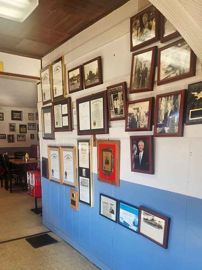 These framed photographs and certificates tell the story of a community that takes pride in its history.
