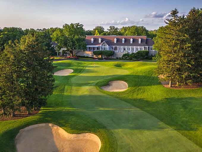 Perfectly manicured fairways stretch toward a clubhouse that looks like it belongs in the Hamptons, not Illinois.