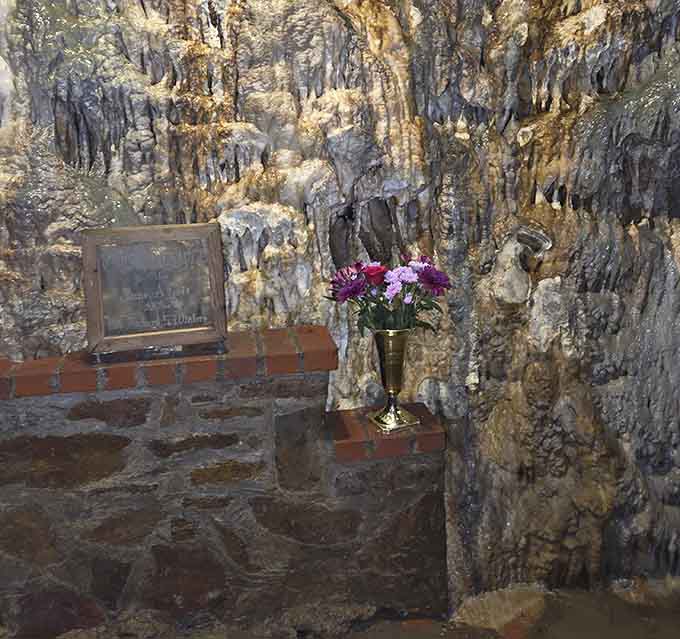 Stone altars and flowstone create a natural chapel where geology becomes something almost spiritual and deeply moving.