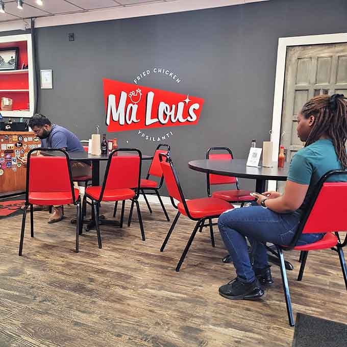 Simple tables, big flavors, and the Ma Lou's logo reminding you exactly where this deliciousness is happening.