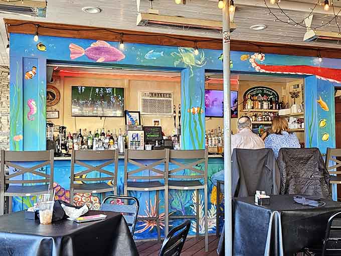 Whimsical underwater murals transform the bar into an aquatic wonderland, making every drink feel like a vacation.