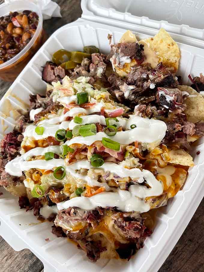 These nachos are loaded with more toppings than a Christmas tree has ornaments, and every single layer promises its own little moment of joy.
