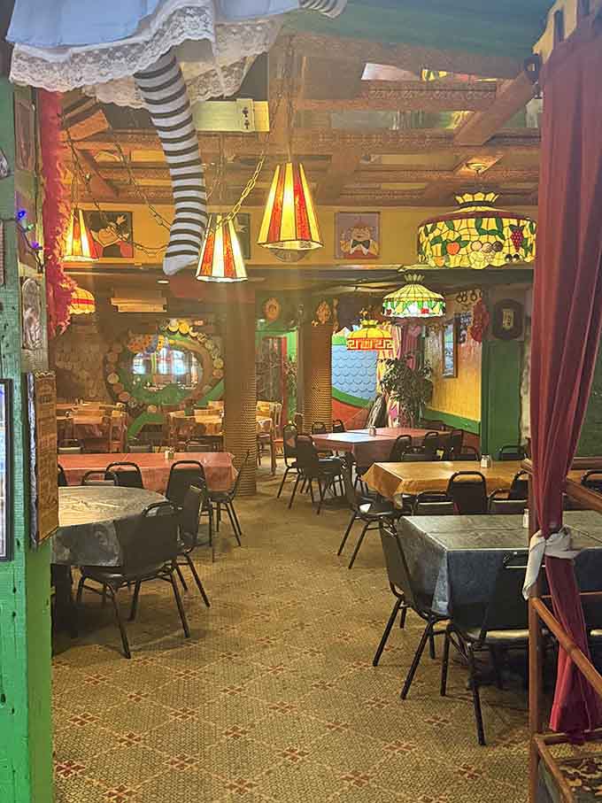 Striped stockings dangling from the ceiling because why shouldn't your dining room feel like Wonderland's tea party?