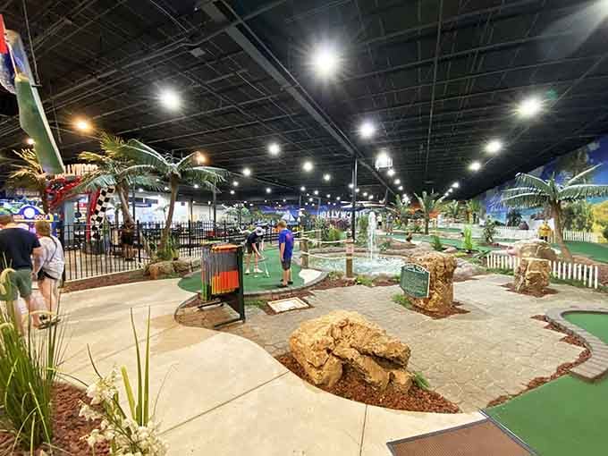 Palm trees and attractions spread across the facility like someone built a beach resort and forgot to add the actual beach.