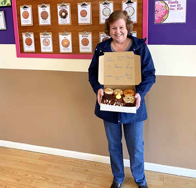 That smile says it all &ndash; she's holding a box of happiness and already planning her next visit here.