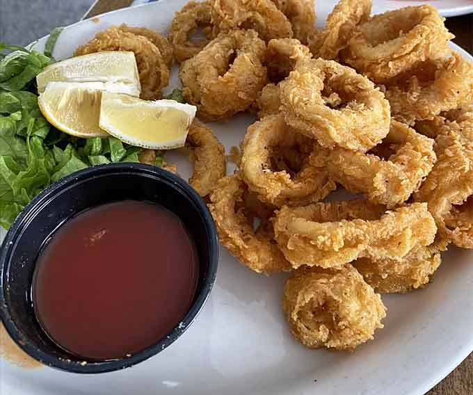 Crispy calamari rings piled high with cocktail sauce waiting patiently are the opening act that steals the show.