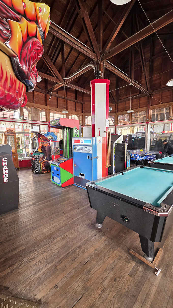 High ceilings and wooden beams frame a treasure trove of games spanning a century of entertainment evolution.