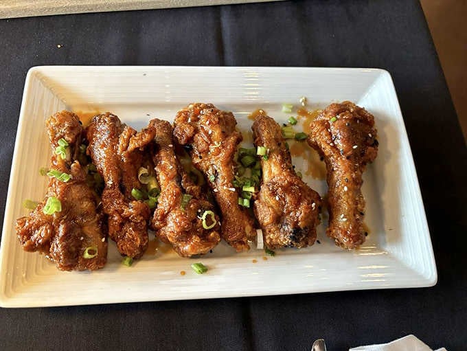 Buffalo duck wings lined up like soldiers ready for duty, bringing sophisticated heat to the classic bar snack.