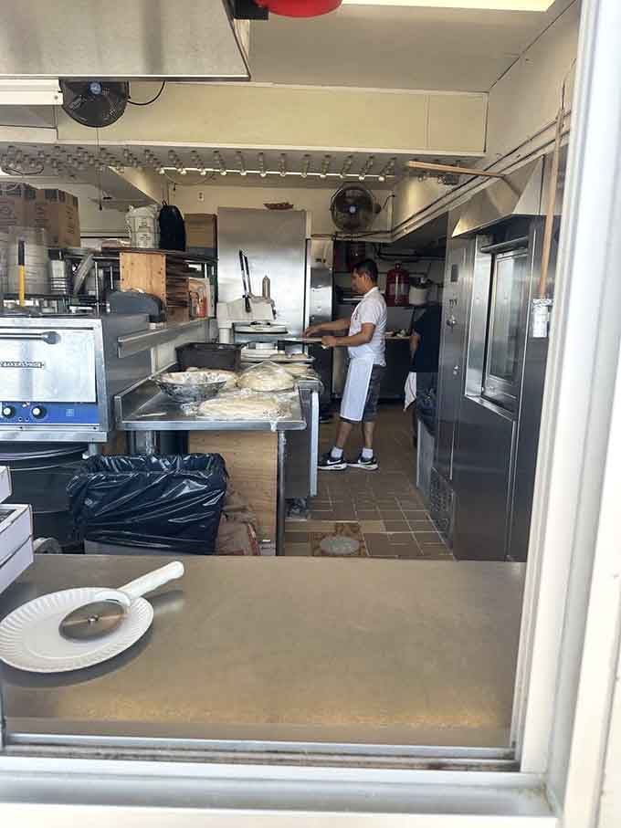 Behind every great pizza is a kitchen where the magic happens, one perfectly stretched dough at a time.