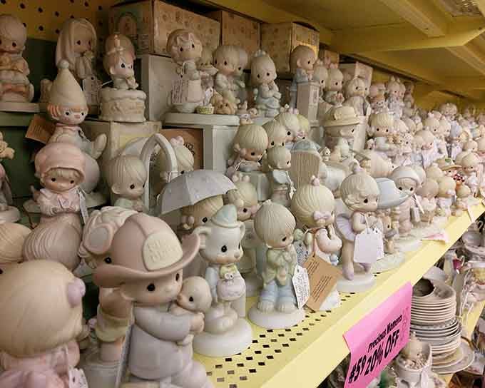 Precious Moments figurines by the hundreds, because apparently someone collected all of them and then some.