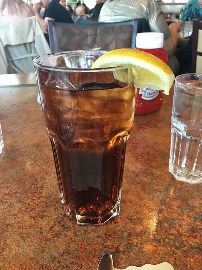 Iced tea with a lemon wedge, the perfect companion for contemplating which enormous breakfast to order.