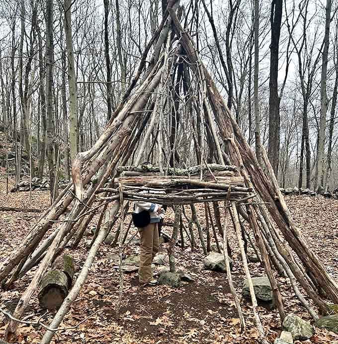 Someone's primitive shelter stands ready for imaginary adventures, delighting kids who still remember how to play outside.