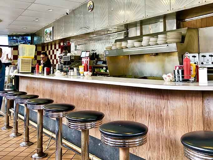 Counter seats with chrome trim where you can watch breakfast being made, dinner theater without the ticket price.