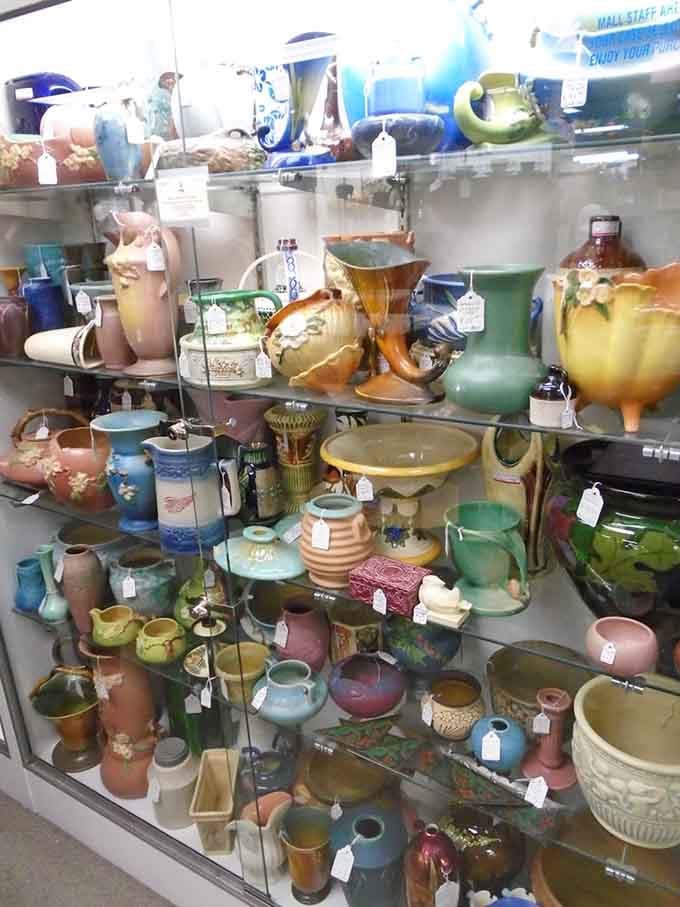 Colorful pottery in every shade imaginable, from earthy browns to vibrant greens, stacked like edible layer cake.