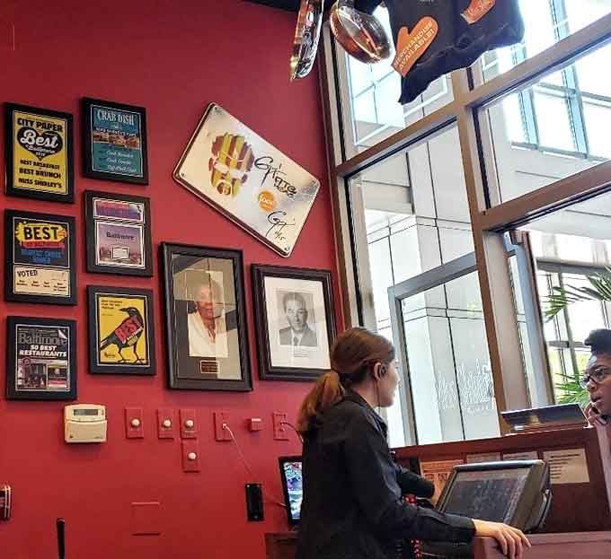 The host station where your breakfast journey begins, surrounded by walls that celebrate their well-earned success.