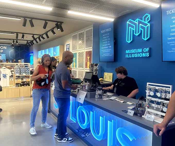 Visitors navigate the tilted corridor where walls play tricks and walking straight becomes an unexpected adventure challenge.