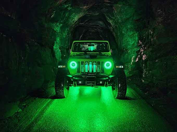 That eerie green glow makes you feel like you're driving into another dimension, which honestly isn't far off.