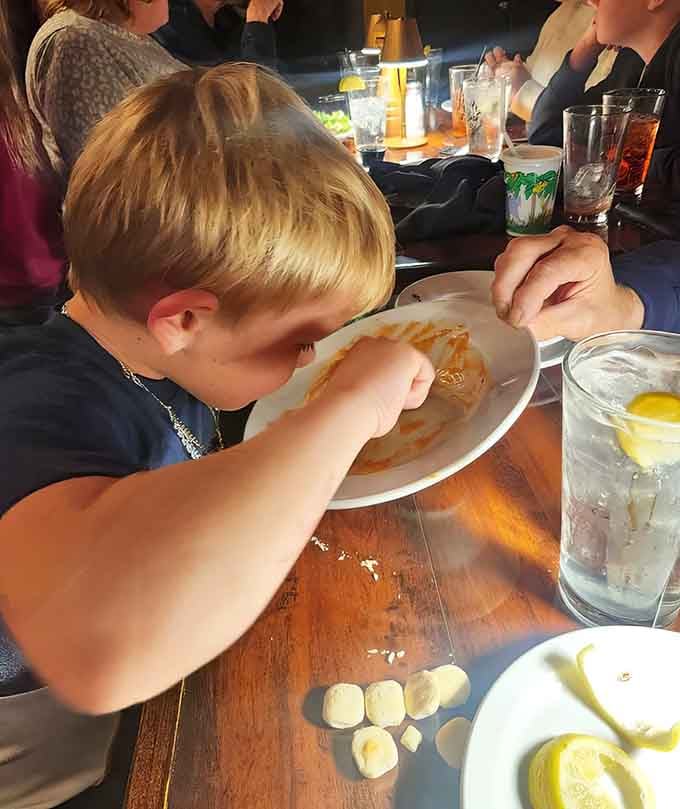Young diners enjoying their meal reminds us that great food creates memories across every generation.