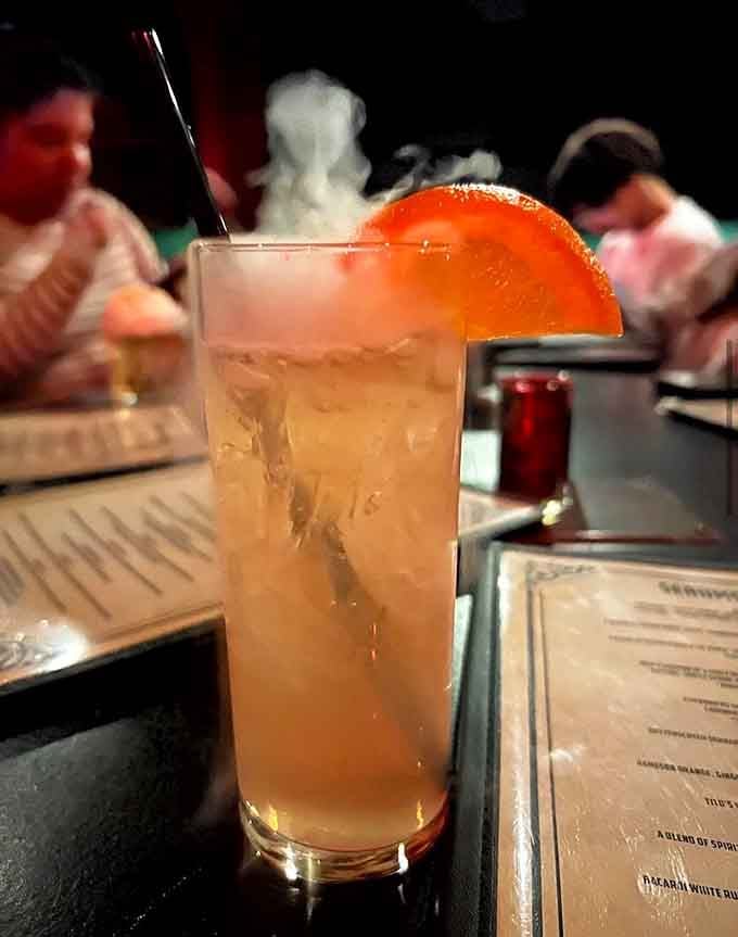 The Headless Horseman cocktail arrives smoking and glowing, making your Instagram followers instantly jealous of you.