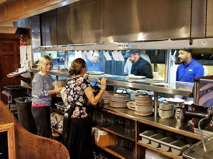 The open kitchen lets you watch the breakfast magic happen, where batter becomes art and eggs reach their destiny.