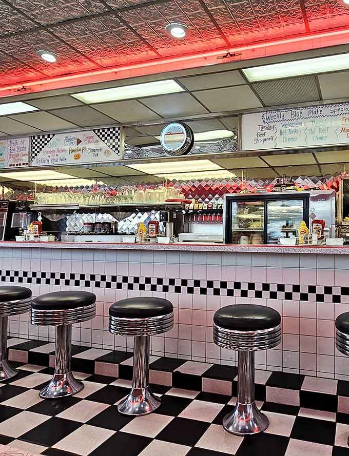 Counter seating with chrome stools offers front-row seats to the griddle action and endless coffee refills.