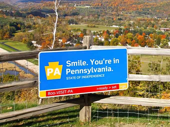 Autumn colors frame this cheerful roadside greeting that makes you want to stop and take it all in.