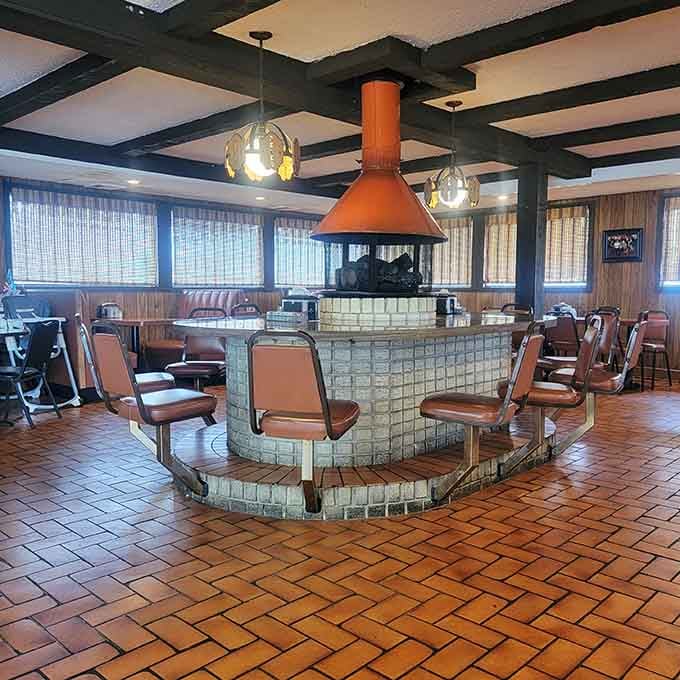 The central fireplace creates a cozy gathering spot that makes you want to linger long after dessert.