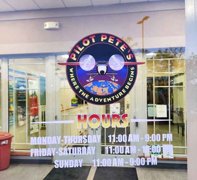 The hours posted on the door promise consistent access to this aviation-themed escape throughout the week ahead.