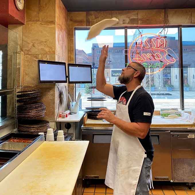 Watching dough get tossed with this kind of confidence makes you appreciate the artistry behind every single slice.