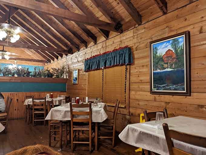 Exposed beams overhead and artwork on the walls create an inviting atmosphere that makes every meal feel like an occasion.