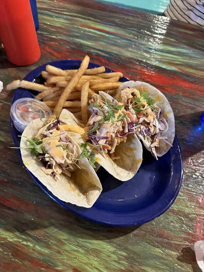 Crispy fish tacos with slaw and fries deliver that satisfying crunch we've been chasing since childhood beach trips.