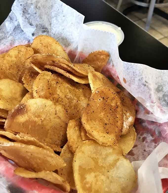 House-made chips seasoned to perfection, proving that sometimes the simplest sides steal the show completely.