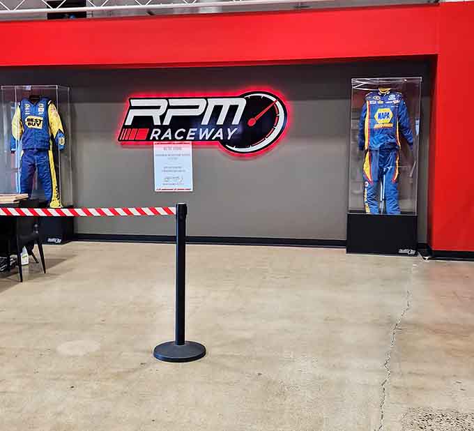 Those racing suits on display represent the professional motorsports aesthetic this place takes seriously, refreshingly so.