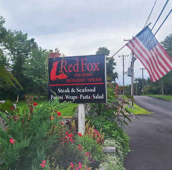 The roadside sign welcomes you to fine dining, wine, and all the steak and seafood your heart desires tonight.