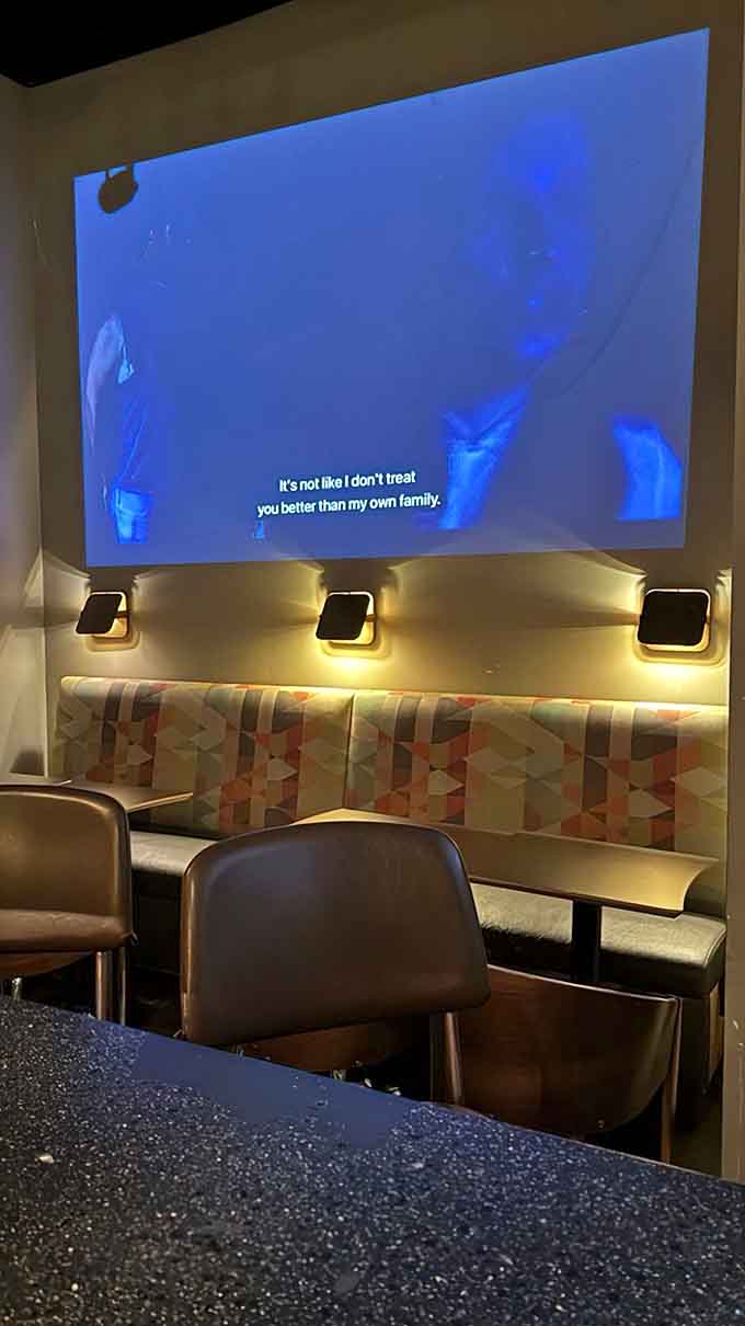 Large screen projections and banquette seating create the perfect backdrop for your cosmic cocktail adventure tonight.