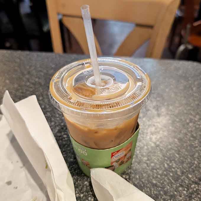 Grab an iced coffee to wash down your massive sandwich, because hydration is important during food marathons.