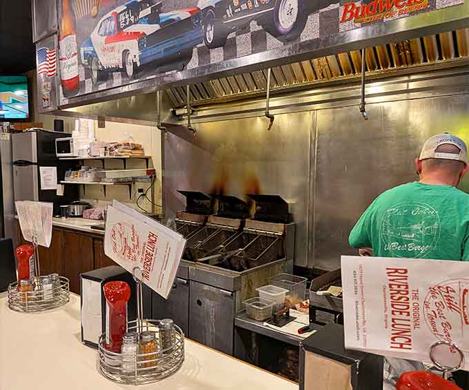 Behind the scenes, the grill works overtime turning out burgers and dogs for the hungry lunch crowd.