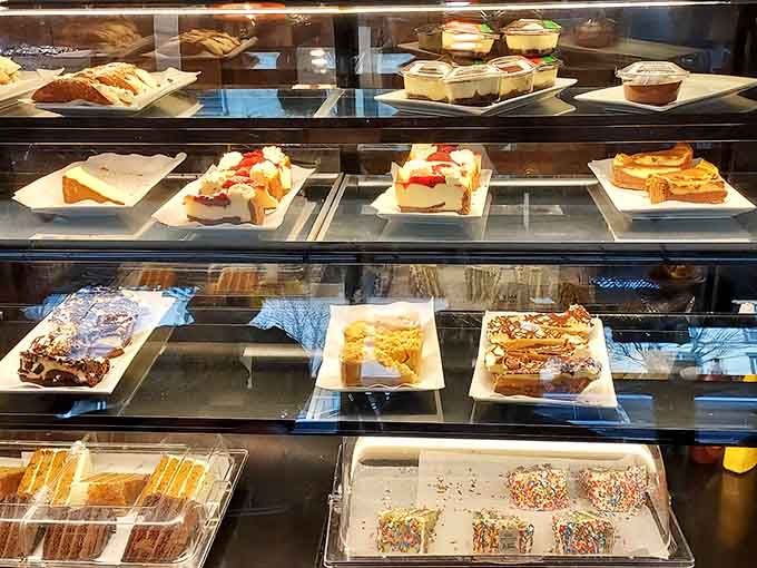 A dessert case that makes every meal feel incomplete until you've selected something sweet to finish.