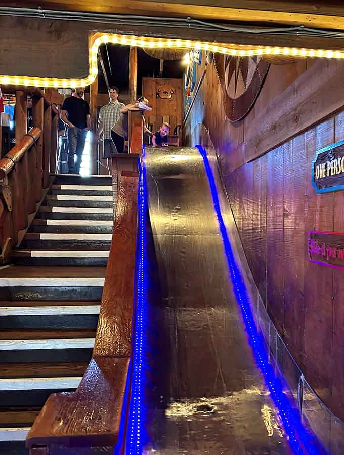 The slide that turns grown adults into giggling kids faster than you can say "pass the steak sauce."